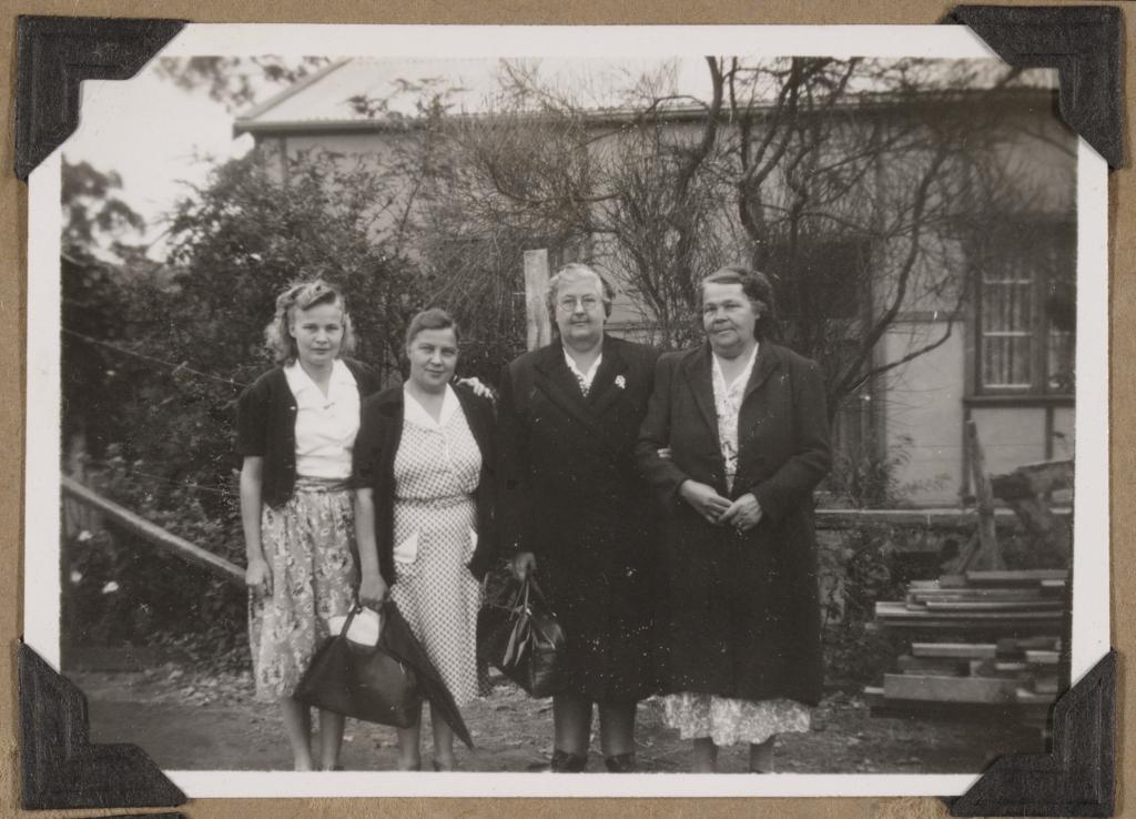 PHOTOGRAPH (DIGITAL): FOUR WOMEN STANDING IN FRONT OF A HOUSE, FROM ...